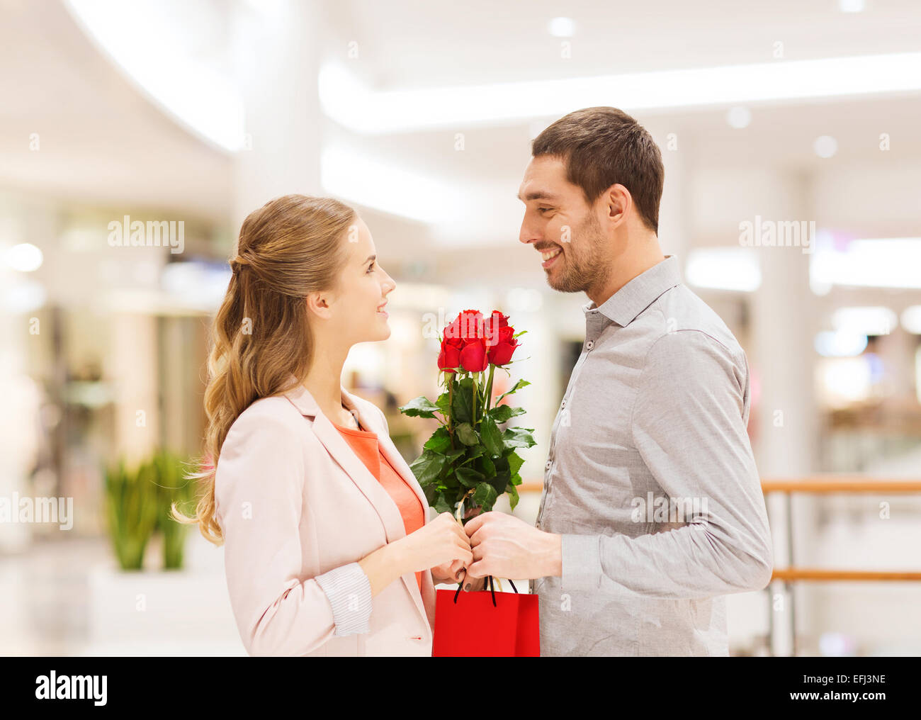 Man woman couple surprise flowers hi-res stock photography and images ...