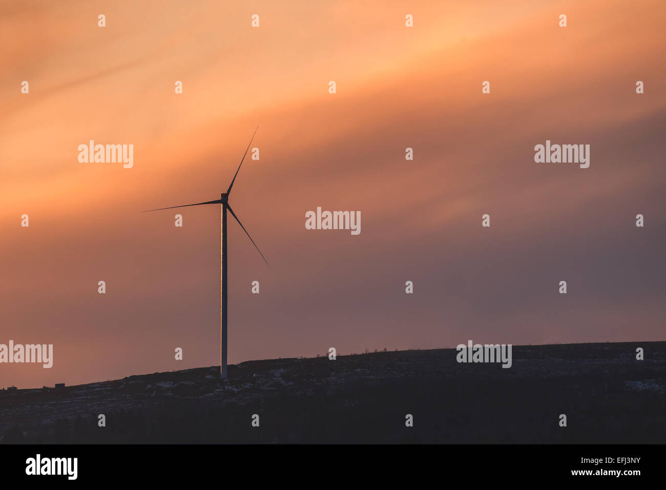 wind turbine on sunset background Stock Photo - Alamy