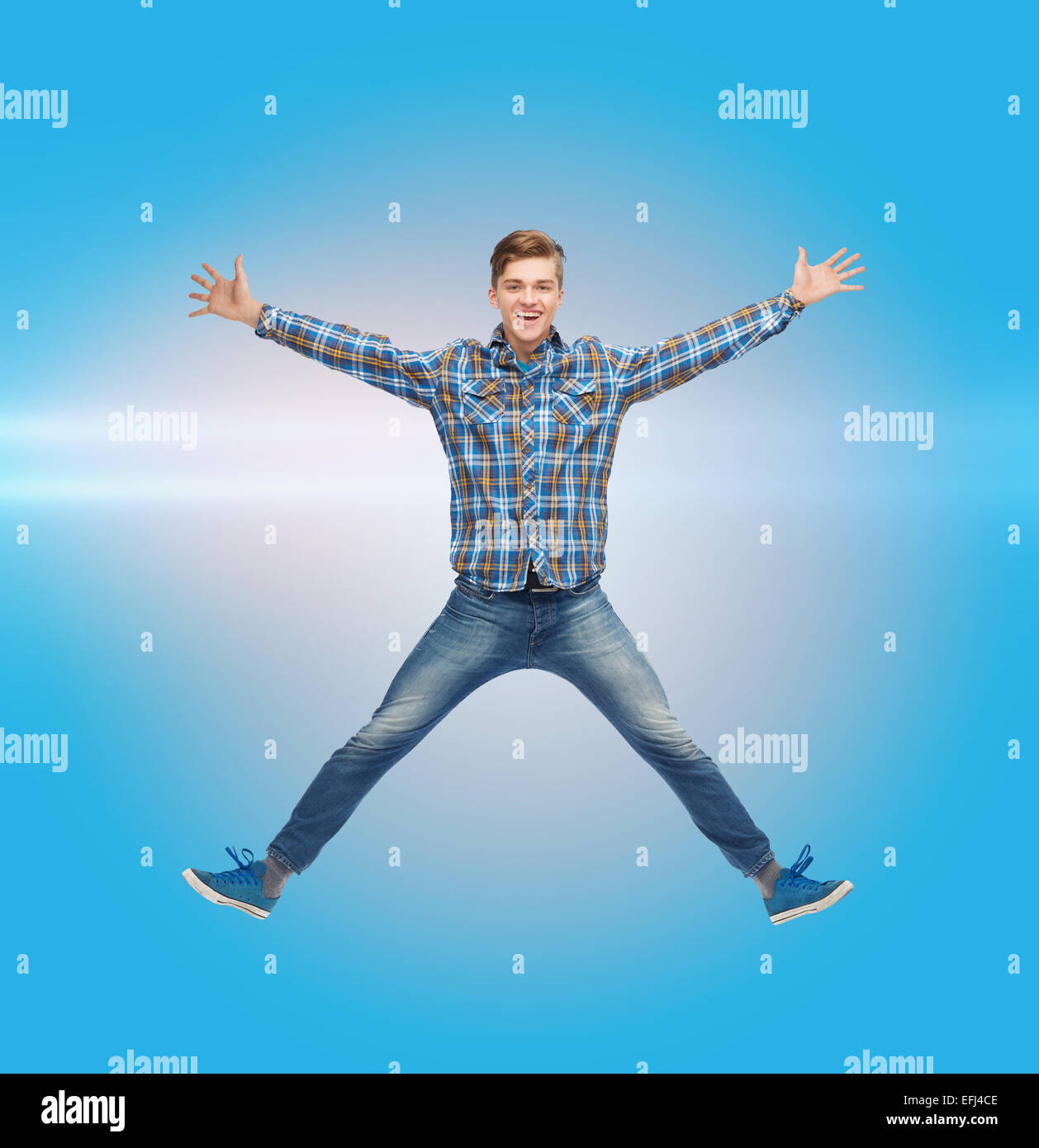 smiling young man jumping in air Stock Photo - Alamy