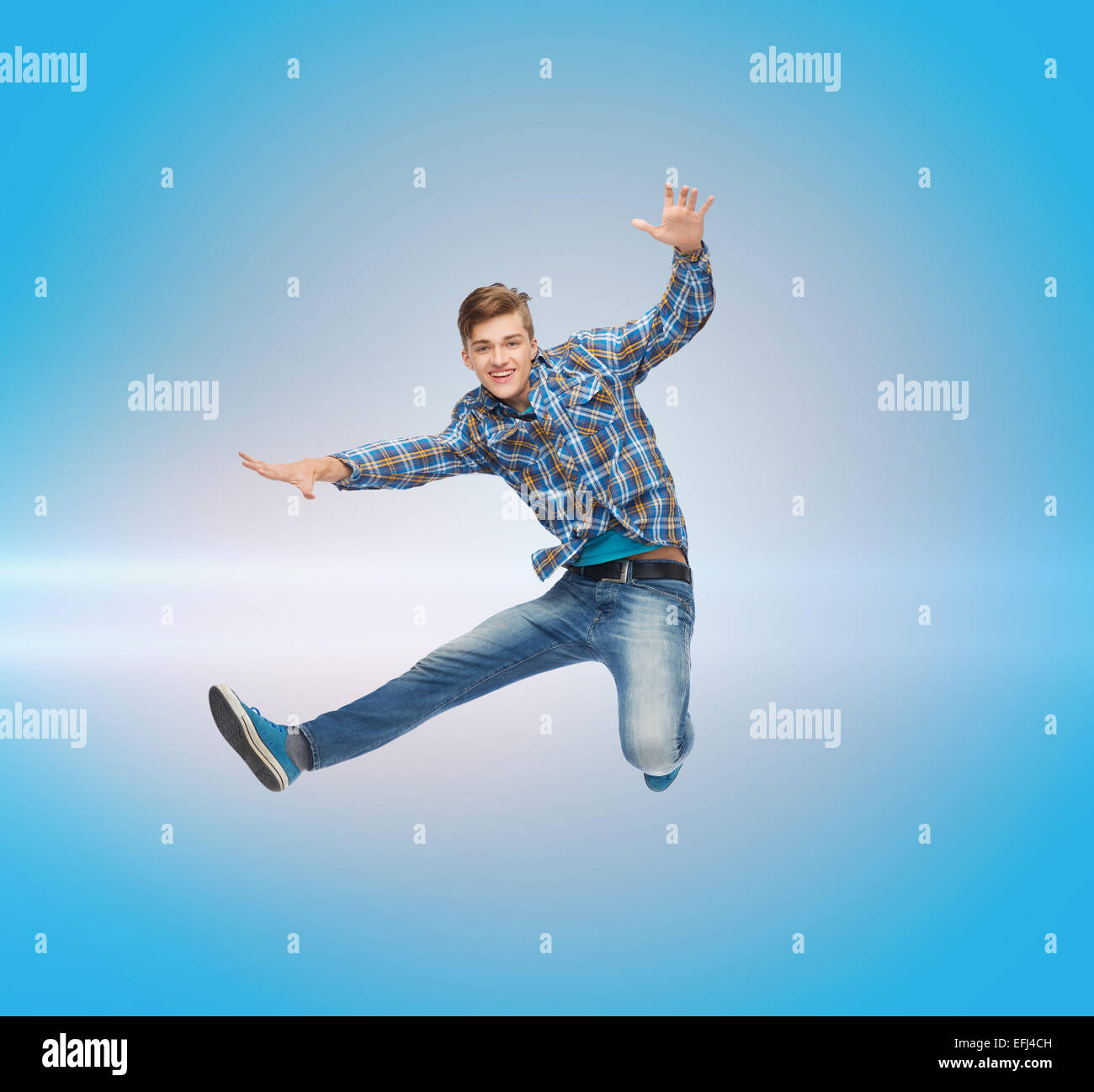 smiling young man jumping in air Stock Photo - Alamy