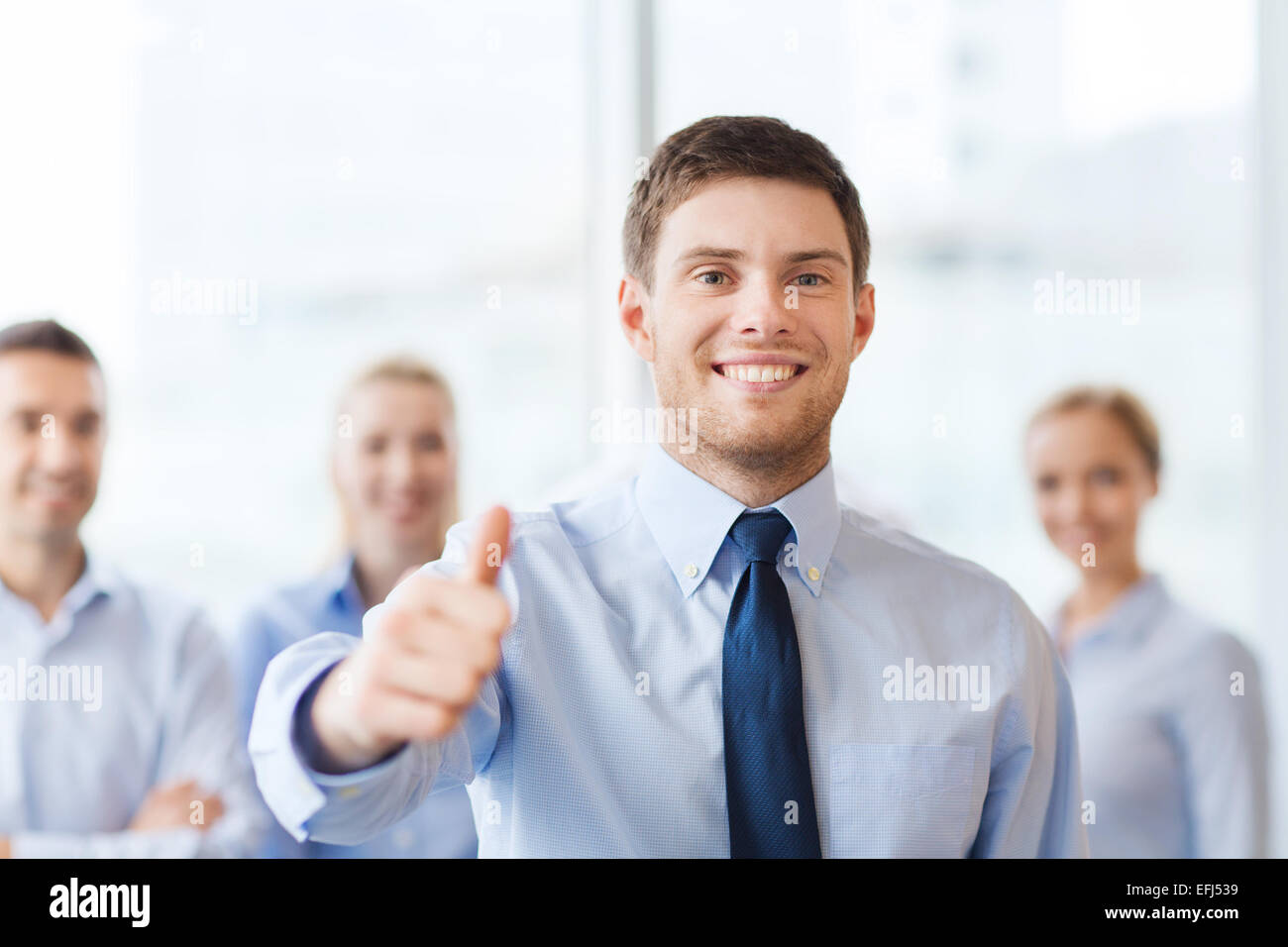 Employees showing thumbs up hi-res stock photography and images - Alamy
