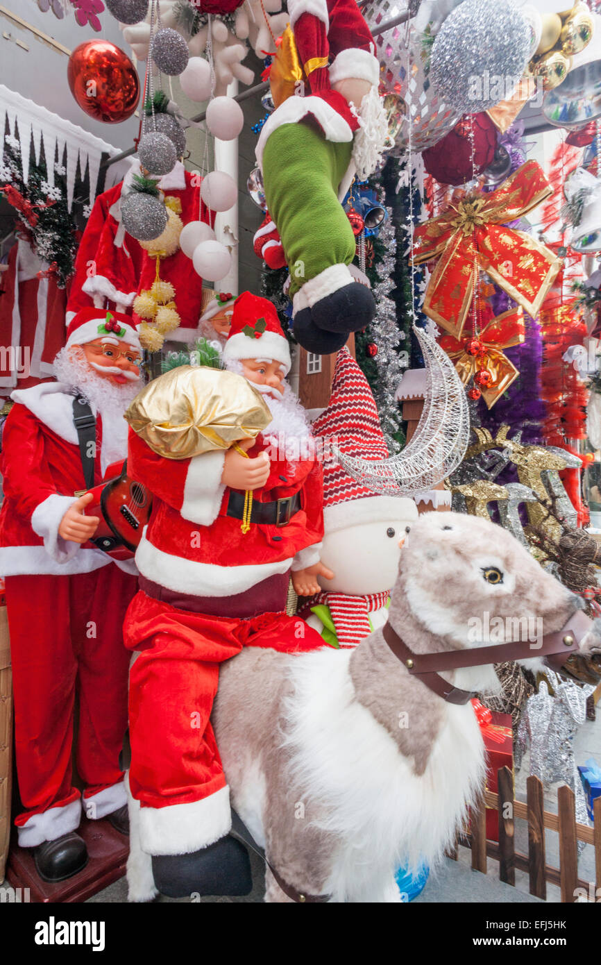 China, Shanghai, Shop Display of Santa Claus Figures Stock Photo - Alamy