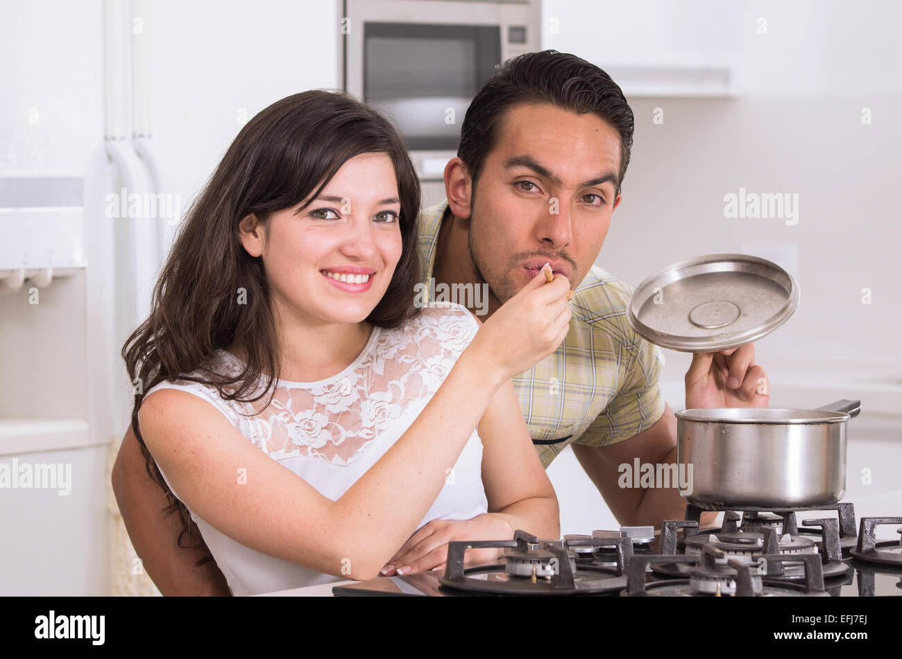 happy attractive couple cooking together Stock Photo - Alamy