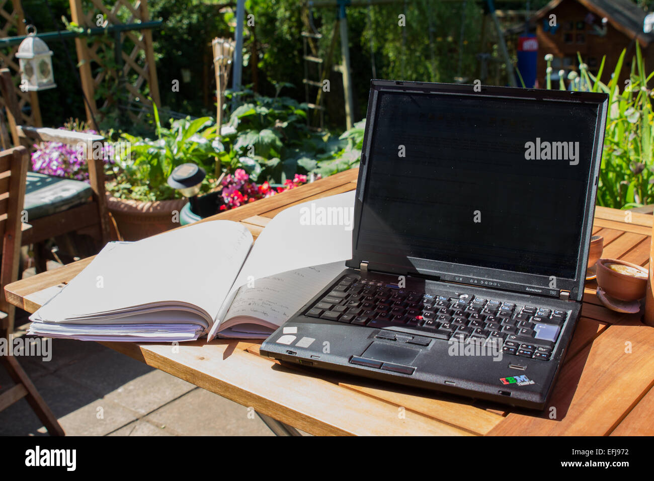Image of laptop set up in garden Stock Photo - Alamy