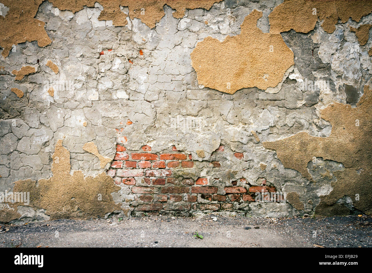 Old weathered wall of bricks and a ground Stock Photo - Alamy