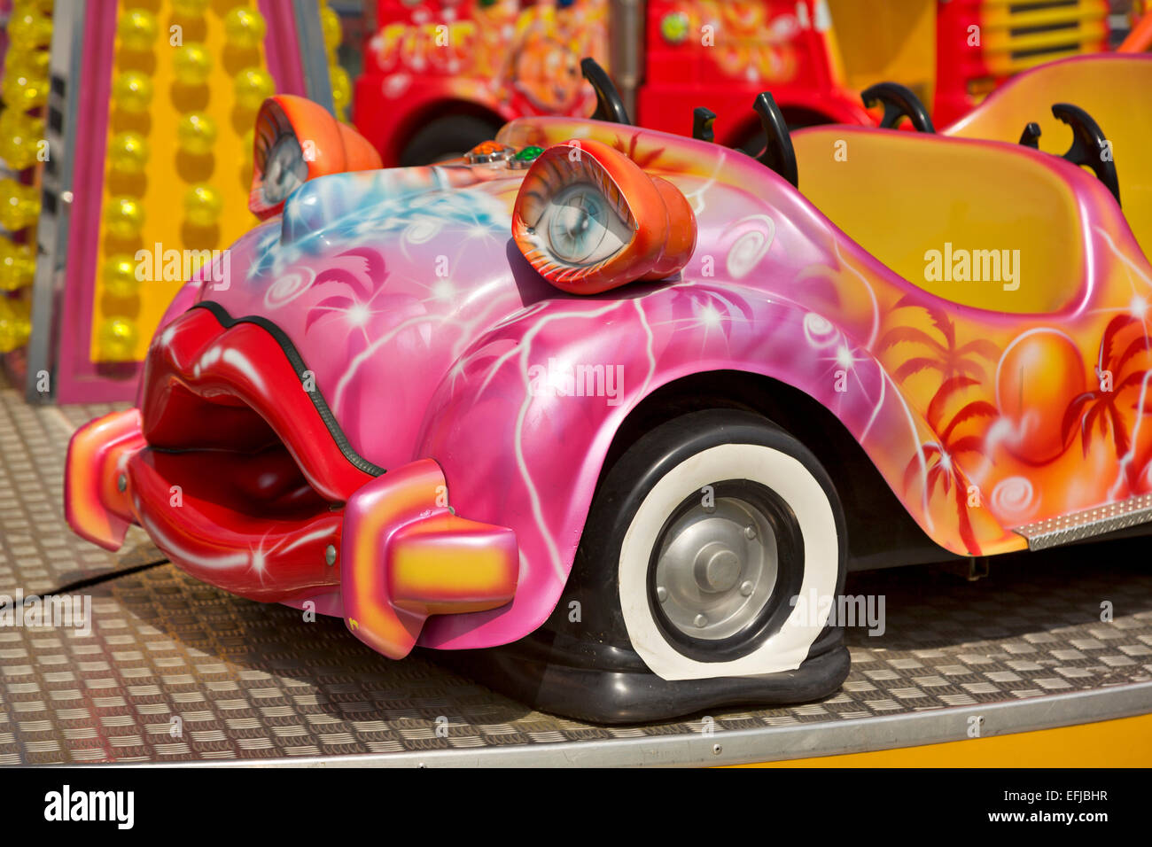 Colourful car with smile on Funfair ride Stock Photo - Alamy