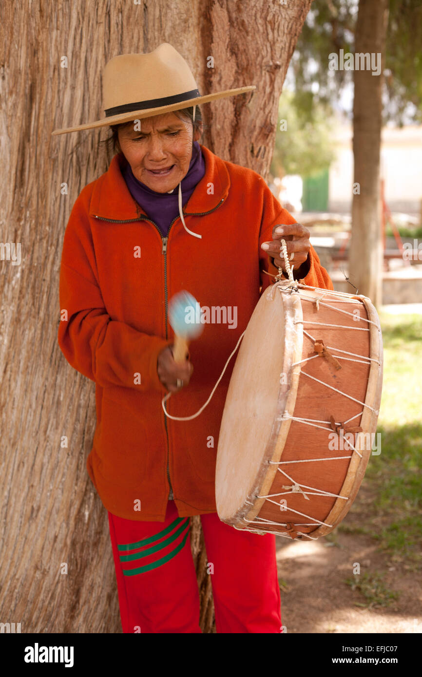 Indigenous women playing drum and singing in Cachi Square Stock Photo ...