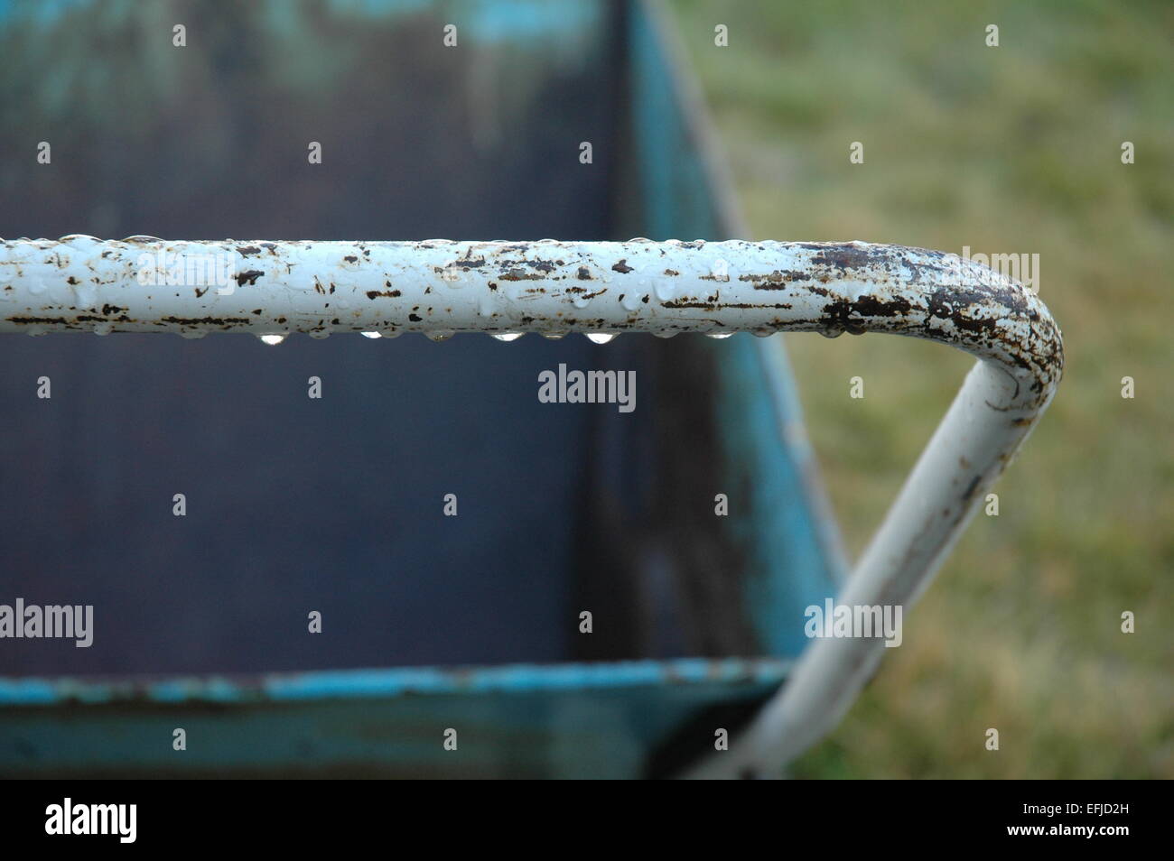 Rain drops on a garden cart handle Stock Photo - Alamy