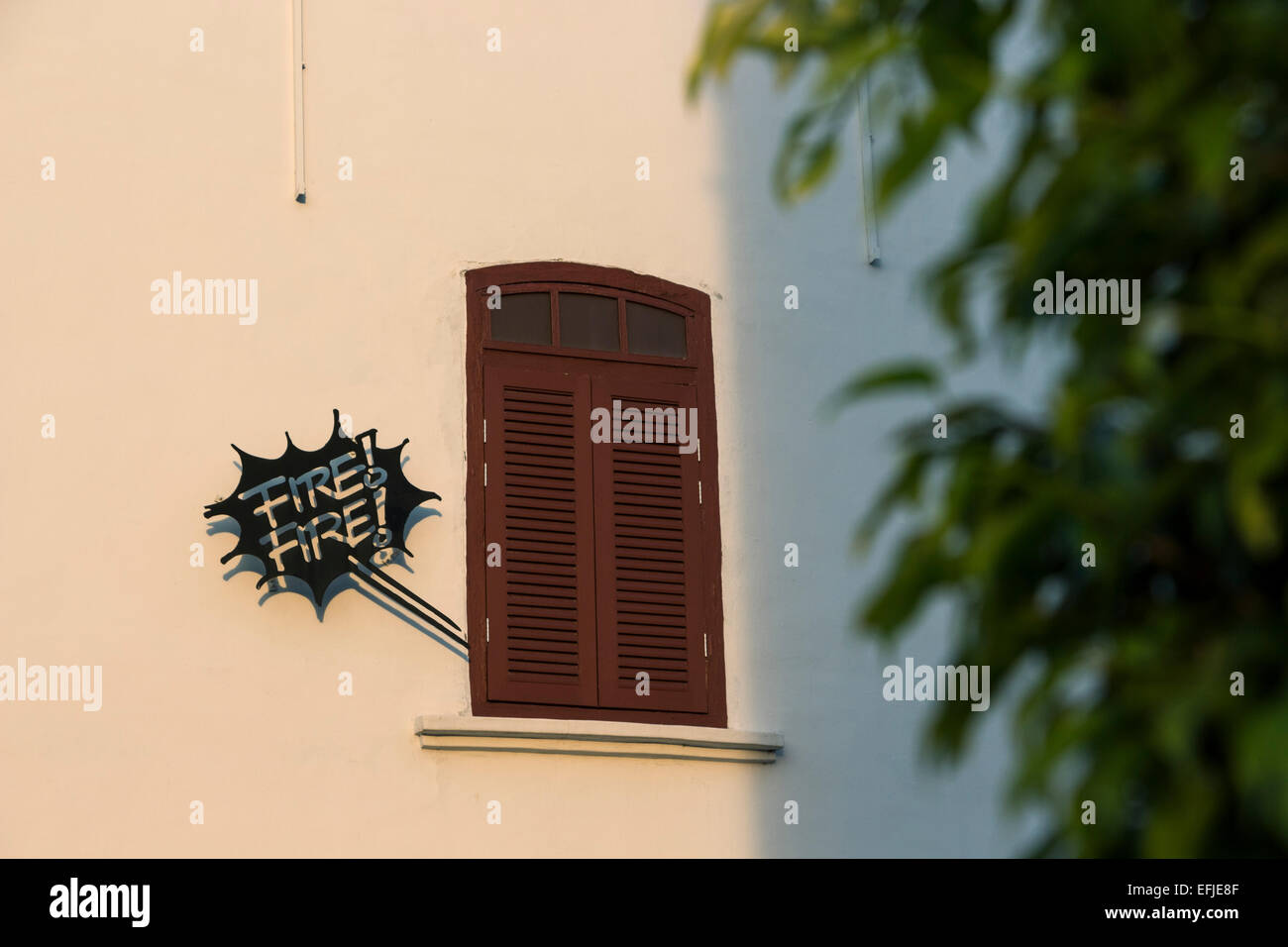 Creative wire art beside windows featuring comic dialogue Stock Photo ...