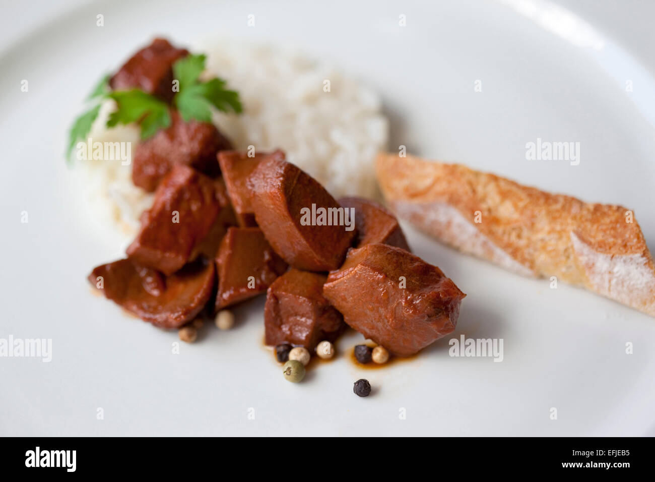 Monkfish, rice and bread on a plate Stock Photo - Alamy