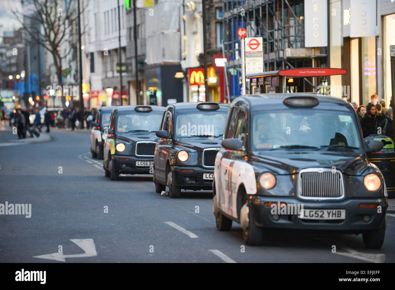 Buses cabs fill oxford street hi-res stock photography and images - Alamy