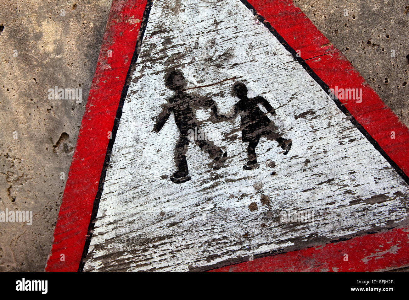 Old wooden road sign showing children Stock Photo - Alamy