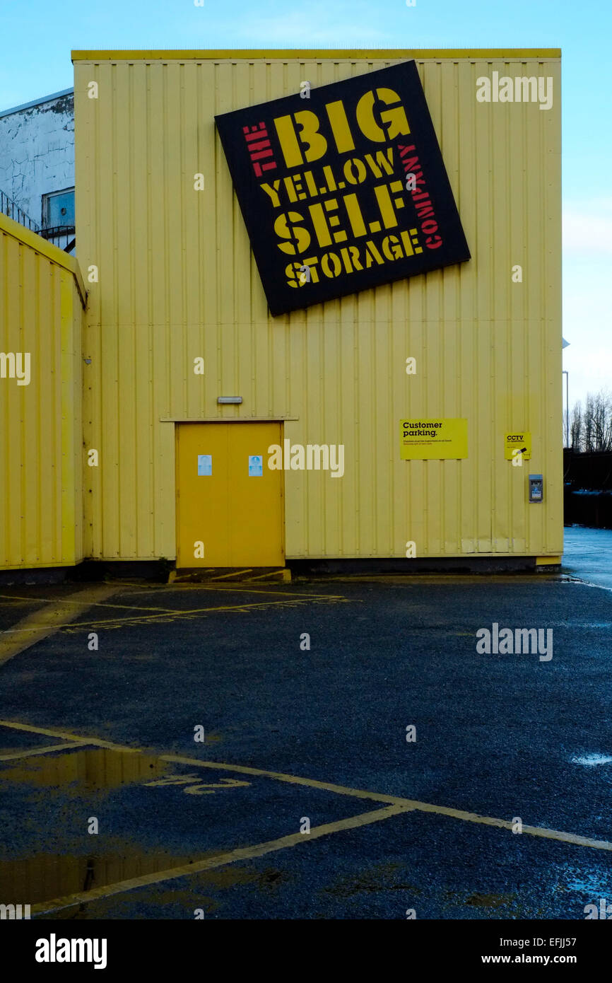 exterior of a big yellow self storage unit Stock Photo - Alamy
