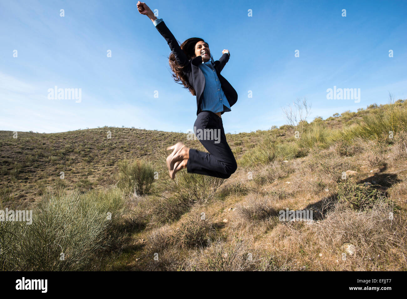 Young women jumping field hi-res stock photography and images - Alamy