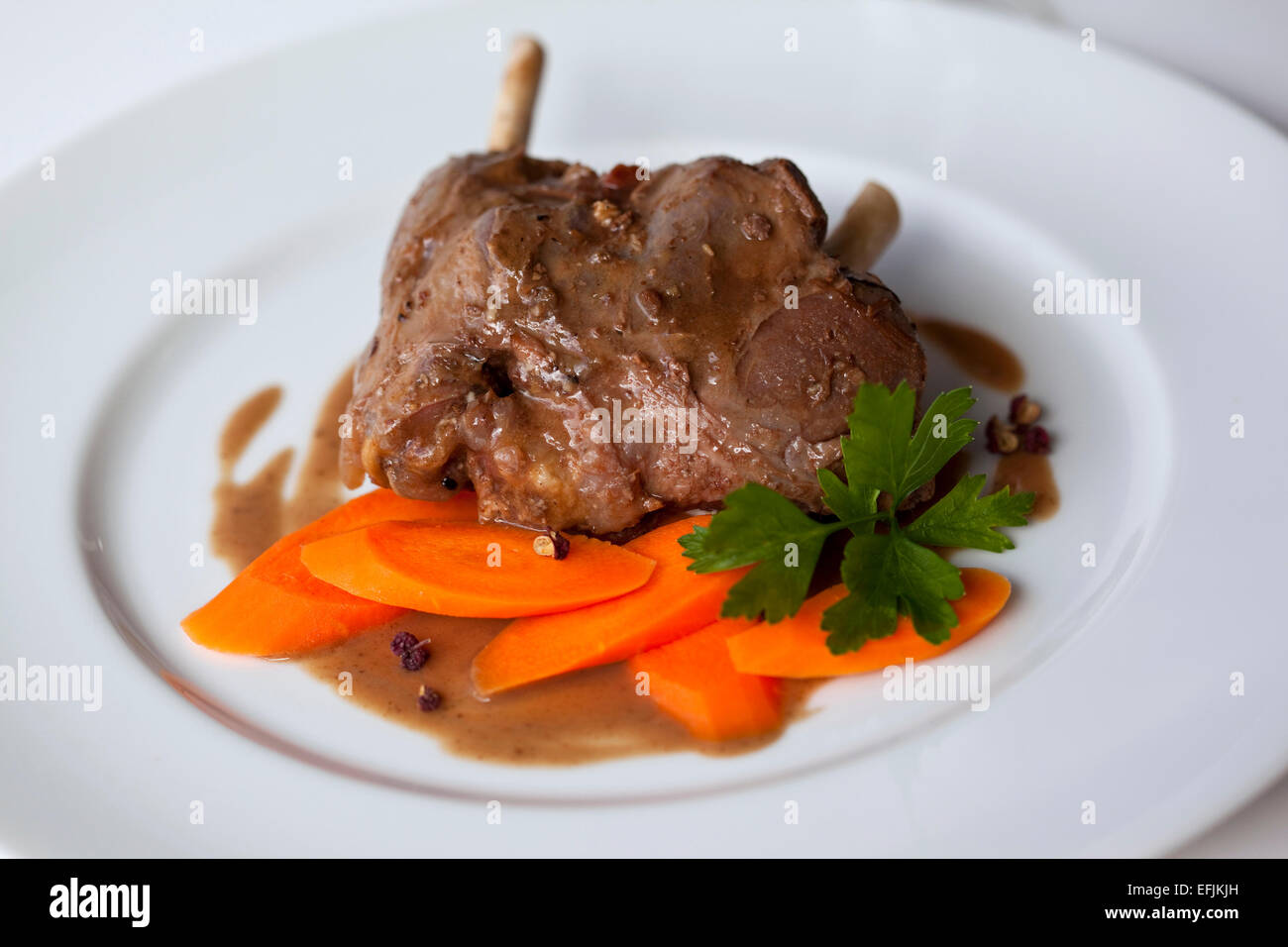 Wild boar stew and carrots Stock Photo - Alamy
