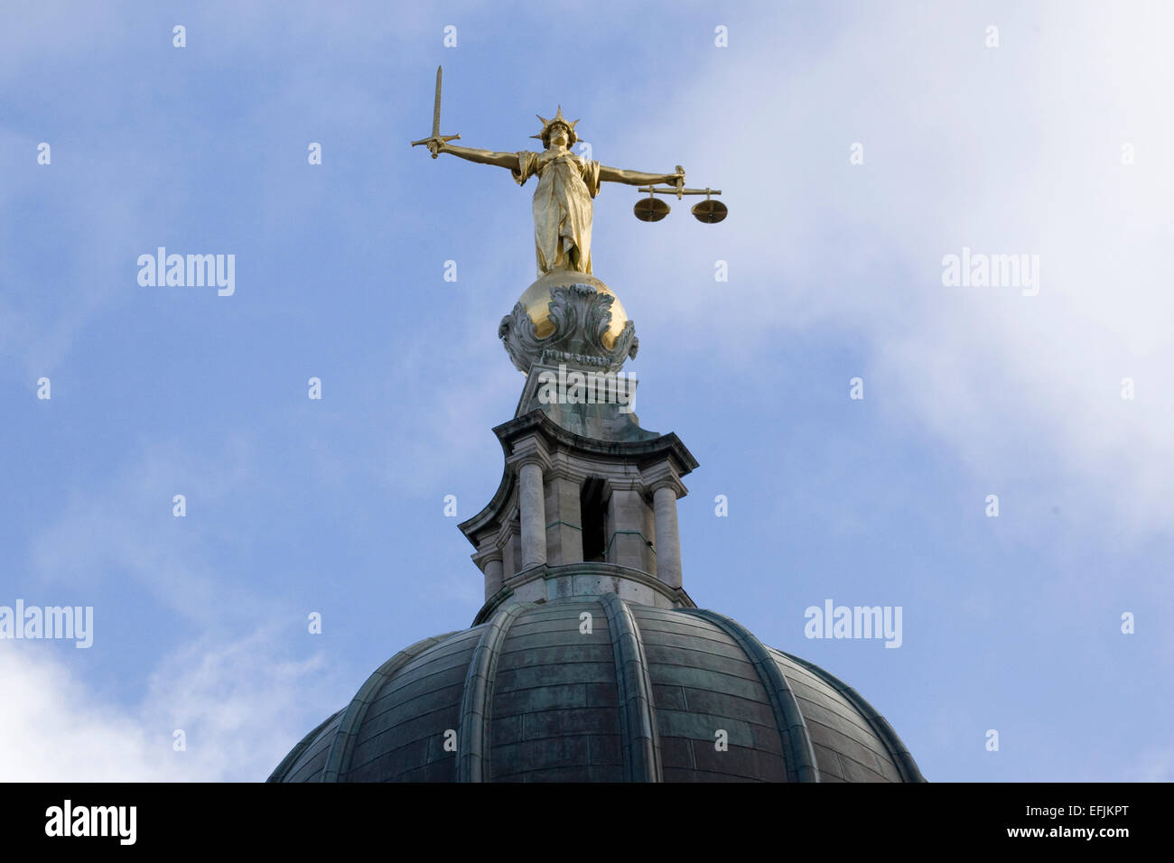 Gold statue of Lady Justice statue on the top of the Old Bailey London ...