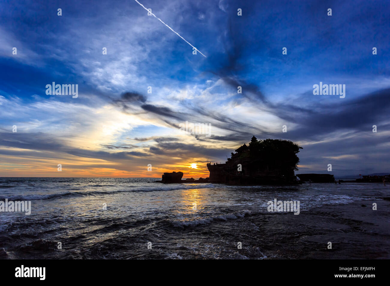 Tahah Lot Temple and ocean waves at sunset, Bali, Indonesia Stock Photo ...
