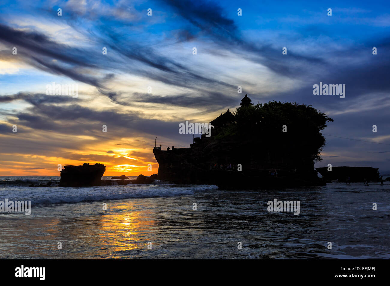 Tahah Lot Temple and ocean waves at sunset, Bali, Indonesia Stock Photo ...