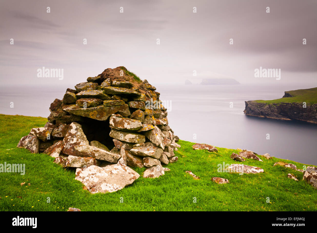 Cleit on Hirta with Boreray covered by clouds visible in the distance ...