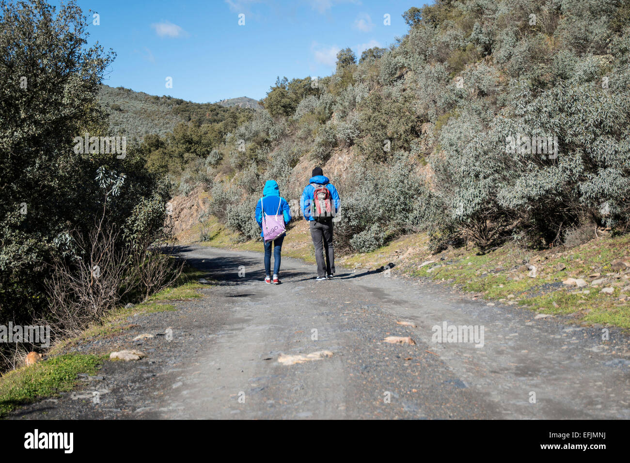 Young couple hiking in rural landscape Stock Photo - Alamy