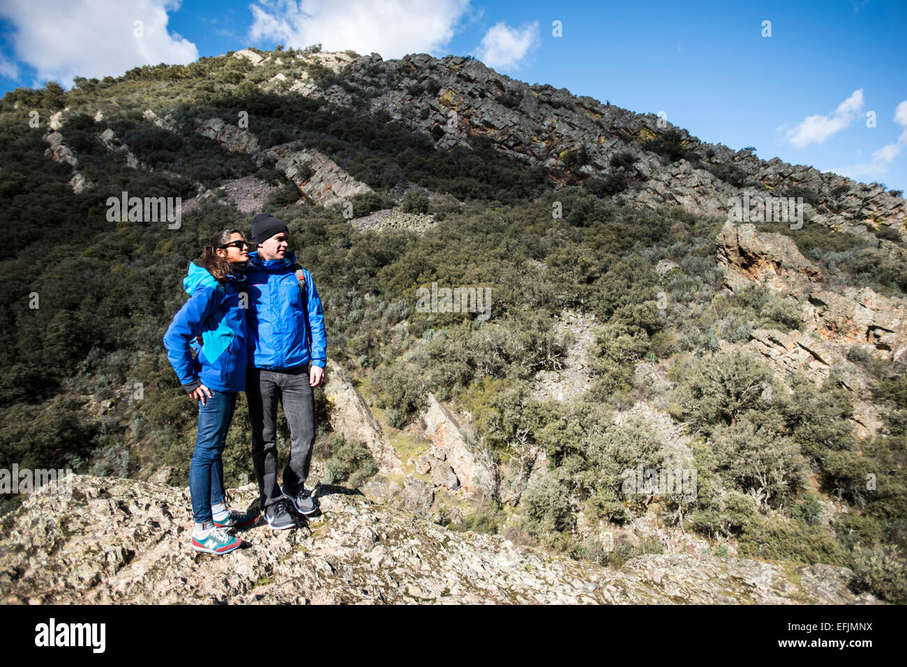 Young couple hiking in rural landscape Stock Photo - Alamy