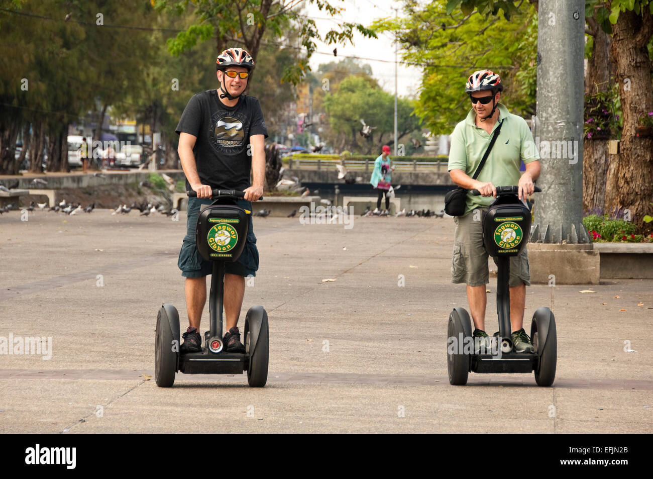 Horizontal view of people on segways in Chiang Mai Stock Photo - Alamy