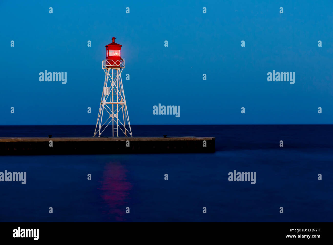 Illuminated lighthouse at Erieau pier in Ontario Stock Photo - Alamy