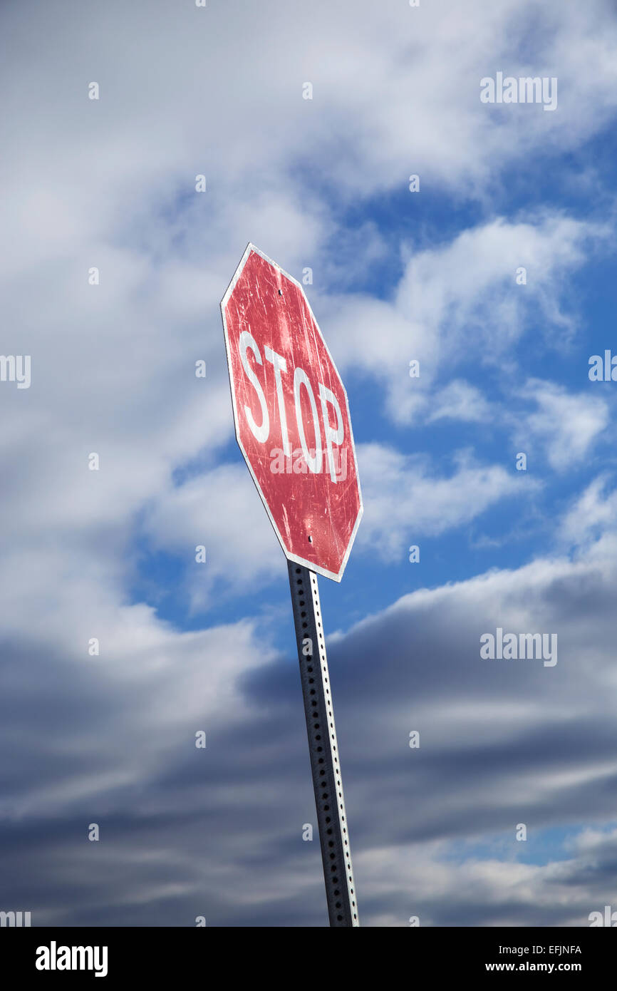 US stop sign with clouds and blue sky behind it Stock Photo - Alamy