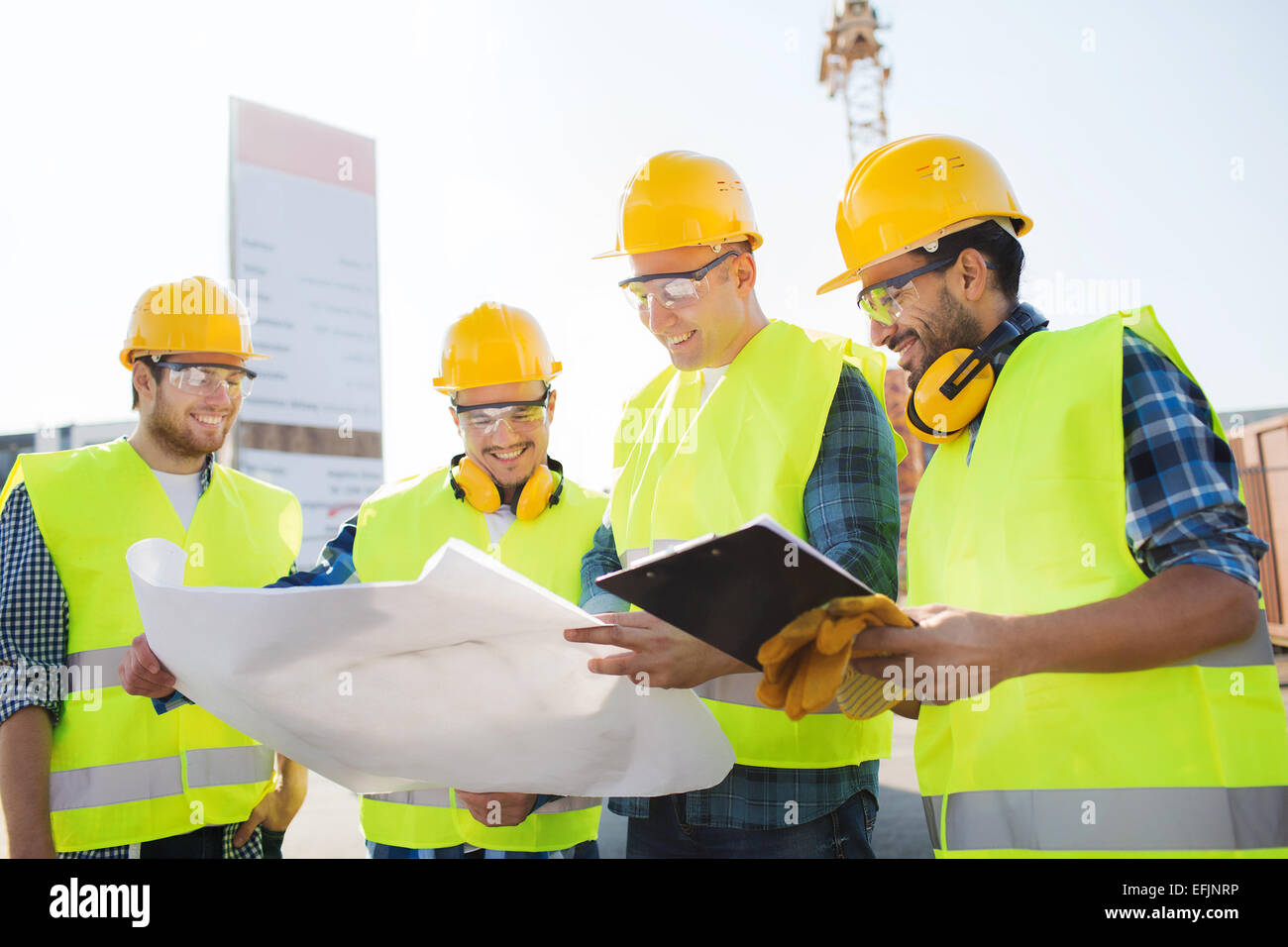 group of builders with tablet pc and blueprint Stock Photo - Alamy