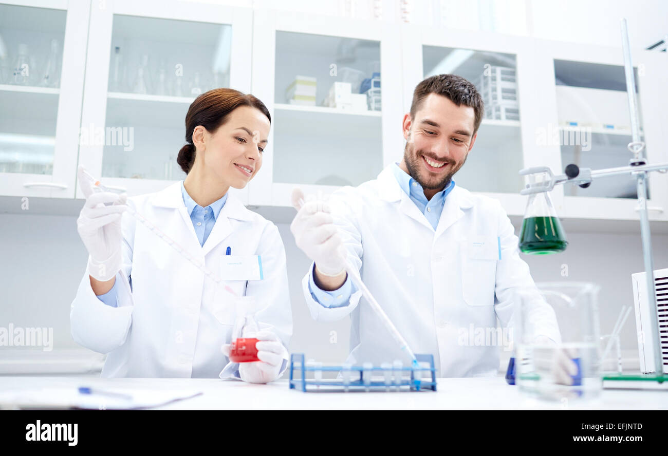 young scientists making test or research in lab Stock Photo - Alamy