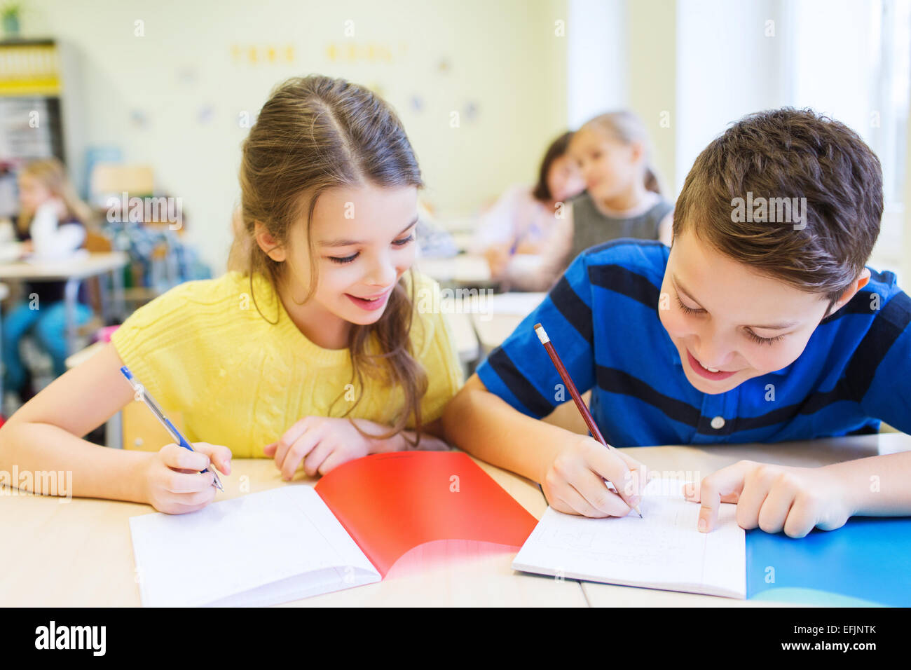 group of school kids writing test in classroom Stock Photo - Alamy
