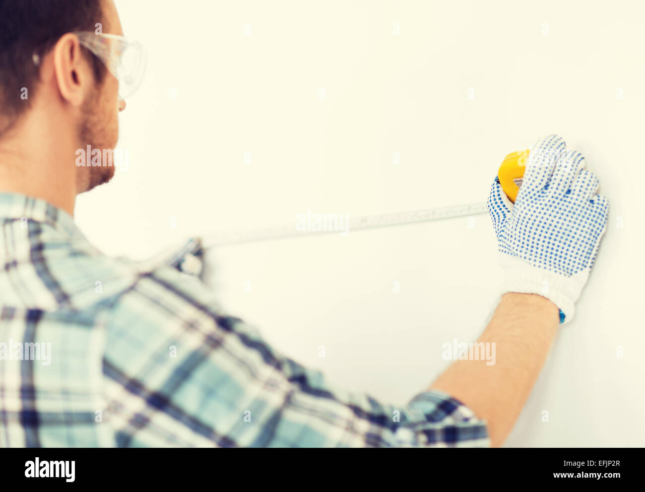 architect measuring wall with flexible ruler Stock Photo - Alamy