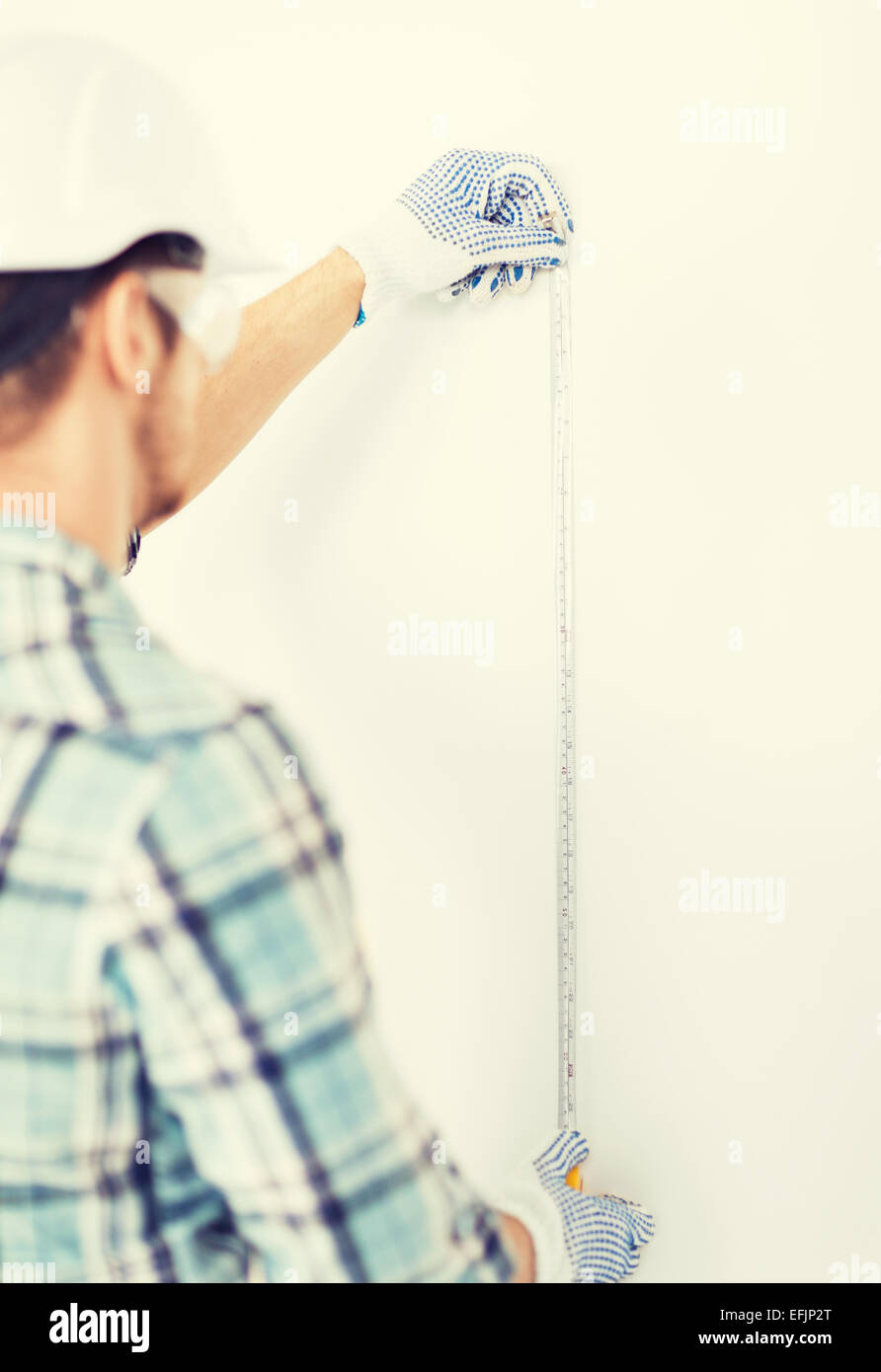 architect measuring wall with flexible ruler Stock Photo - Alamy