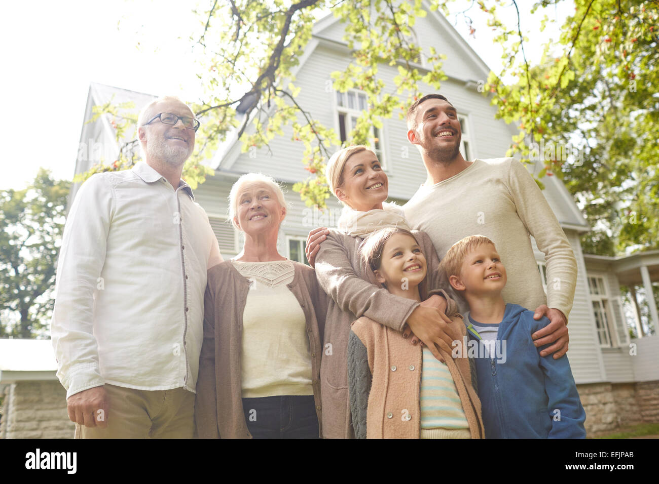 happy family in front of house outdoors Stock Photo - Alamy