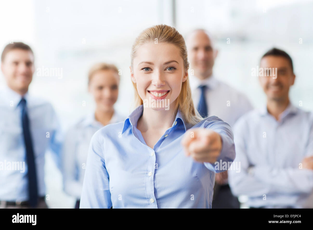 smiling businesswoman pointing finger on you Stock Photo - Alamy