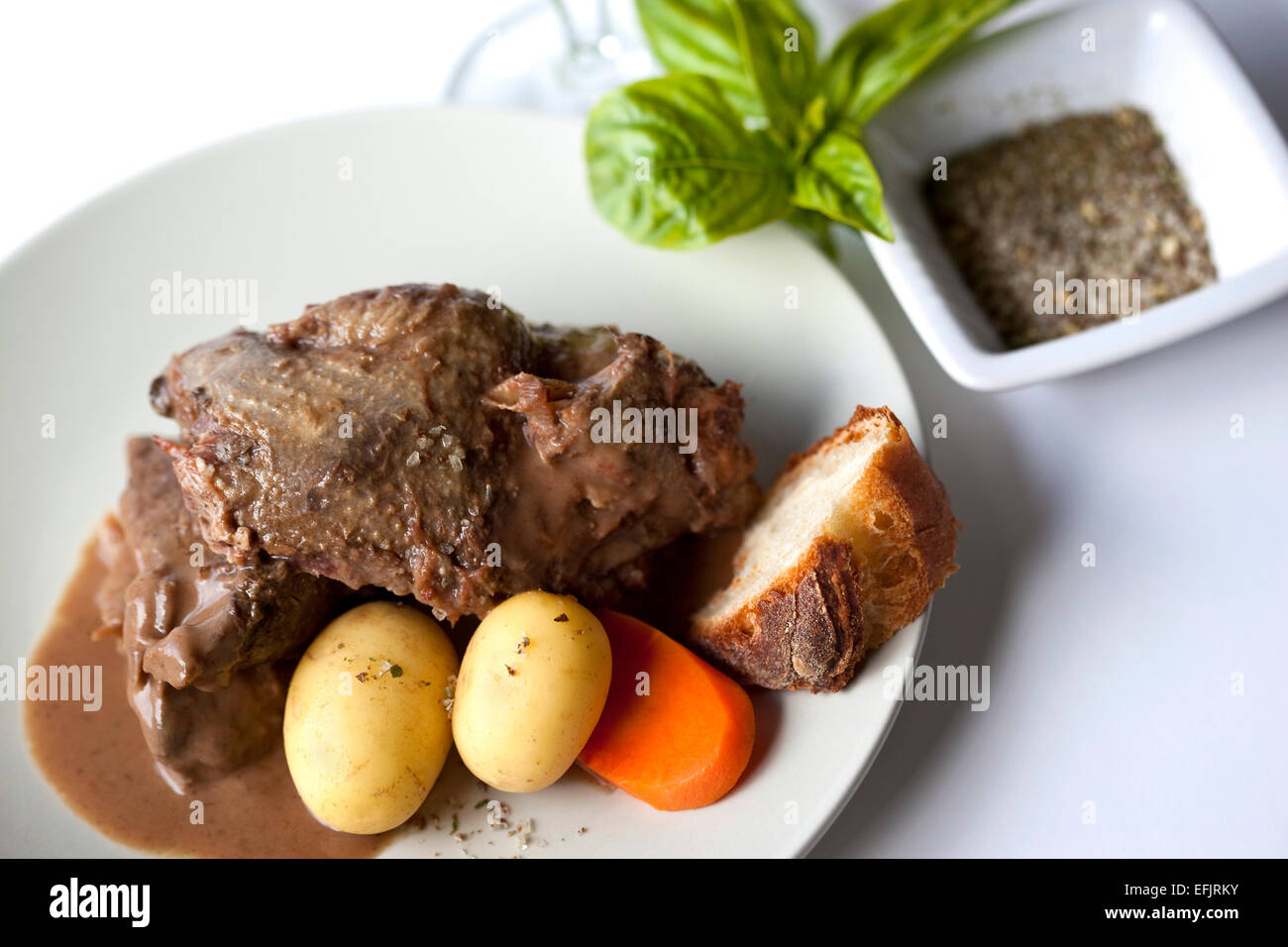 Pigeon stew and vegetable on a plate Stock Photo - Alamy