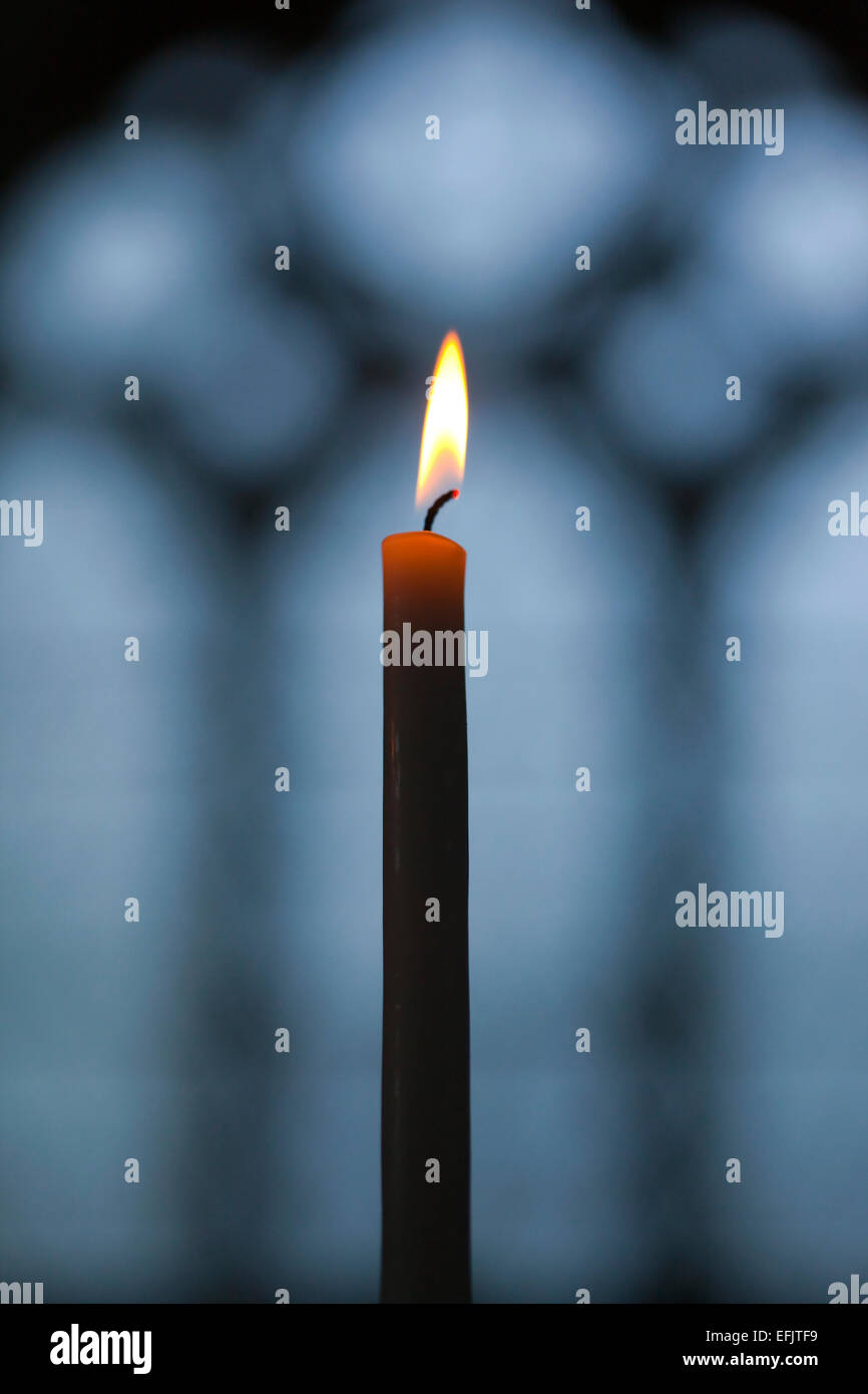 Flame of a candle in a church Stock Photo - Alamy