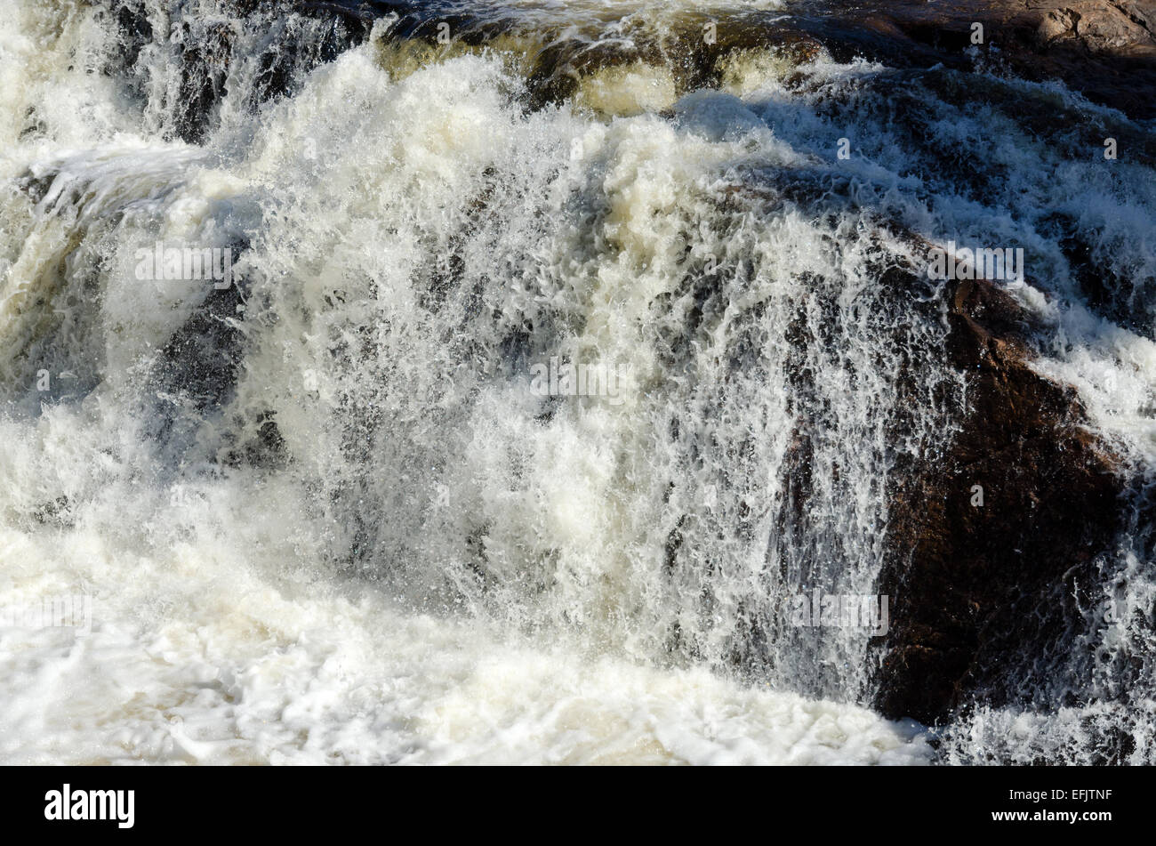 Cascading water over rocks in Superior Lake Provincial park, Canada ...