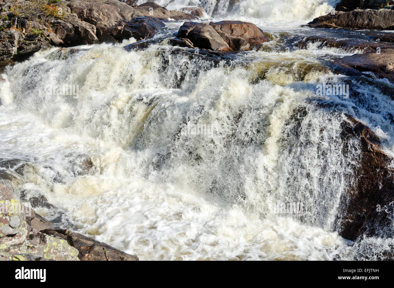 Cascading water over rocks in Superior Lake Provincial park, Canada ...