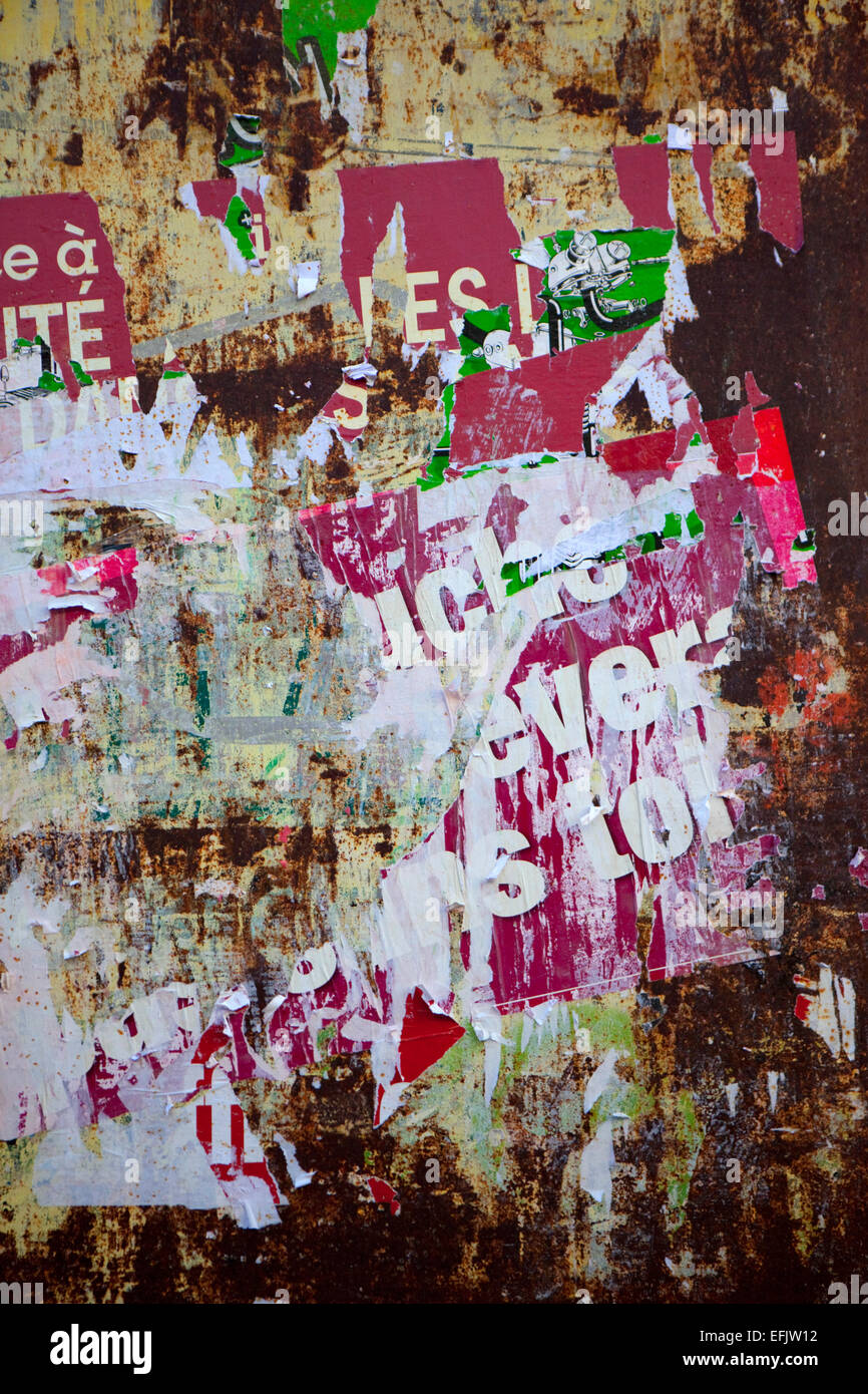 Torn posters on the wall Stock Photo - Alamy
