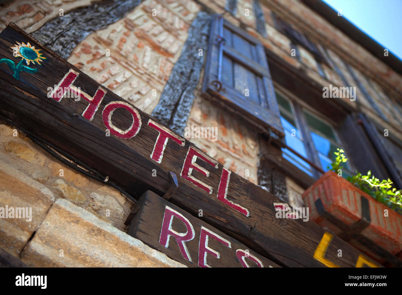 Facade of an old rustic hotel in France Stock Photo - Alamy