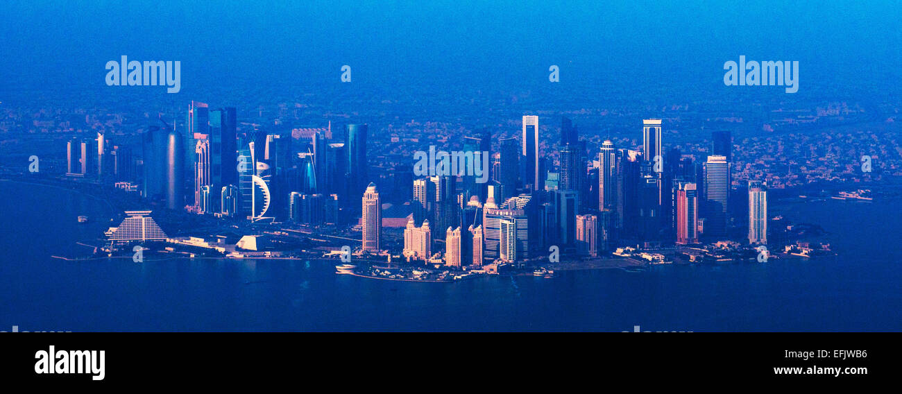 Doha's financial center as seen shortly after sunrise from the air ...