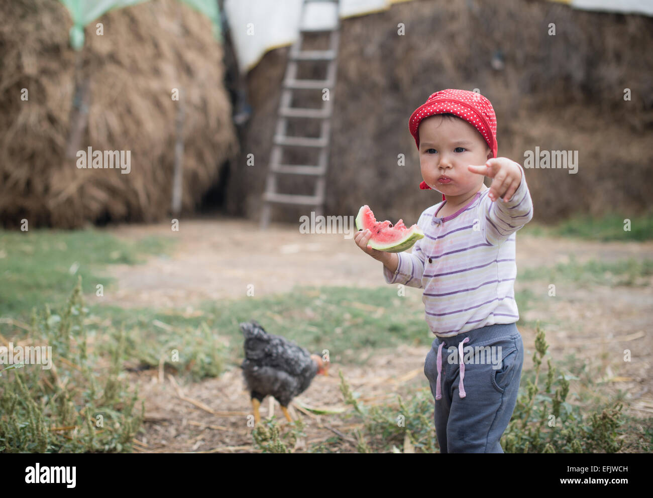 Toddler eating melon hi-res stock photography and images - Alamy