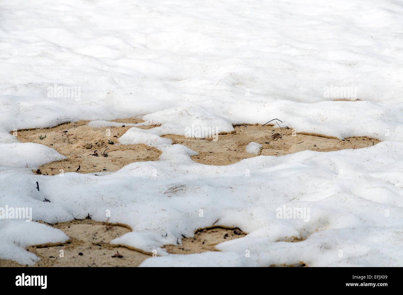 Melting snow on sandy beach of Upper Peninsula, Michigan Stock Photo ...