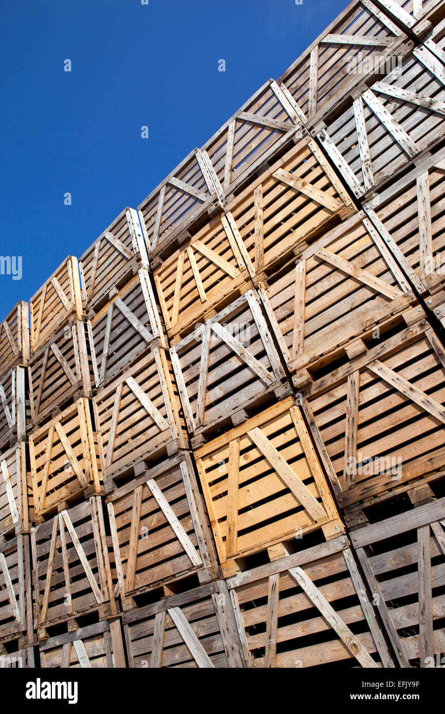 Piles of wooden boxes in a factory Stock Photo - Alamy