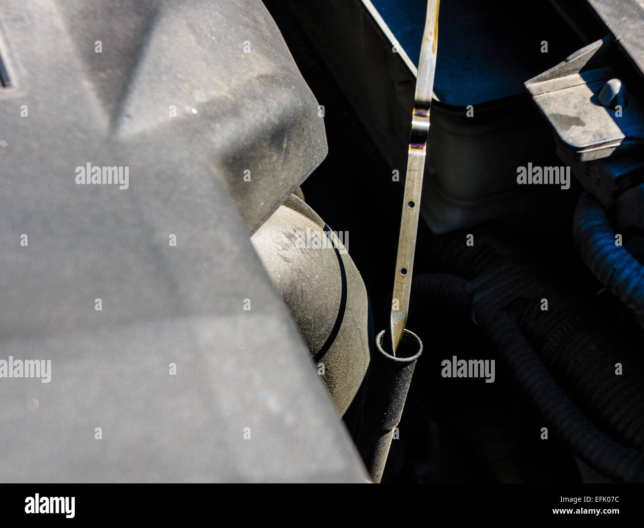 Inspection checking the oil level in a car engine during routine ...