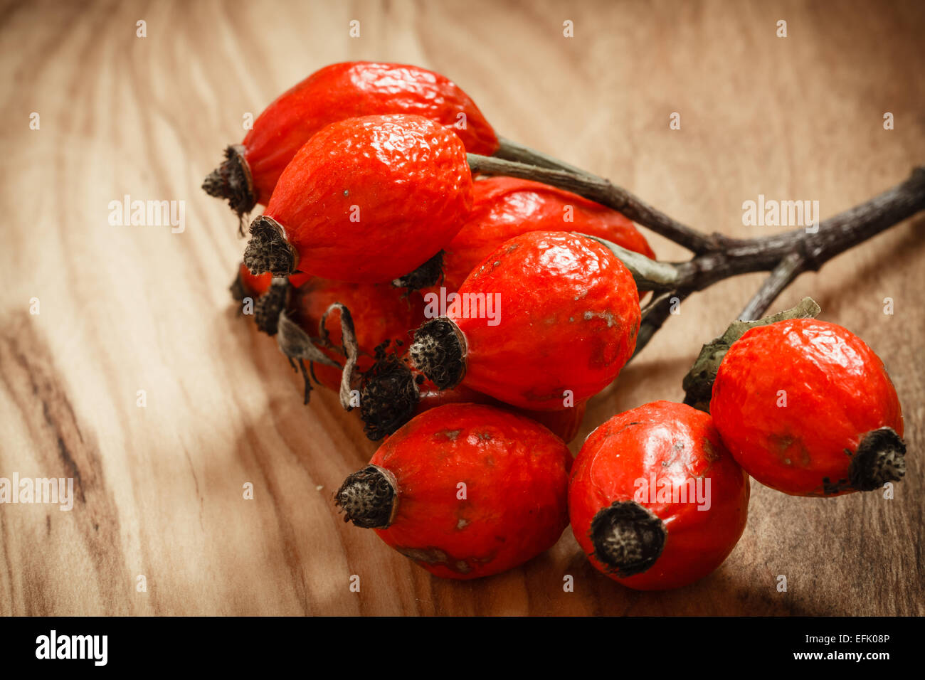 Hawthorn on wooden rustic table background. Rose hips haw fruit of the ...