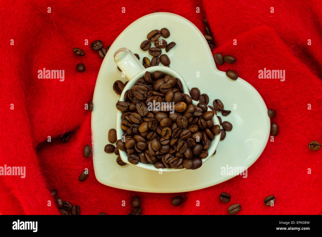 Coffee klatsch java concept. Heart shaped white cup filled with roasted ...