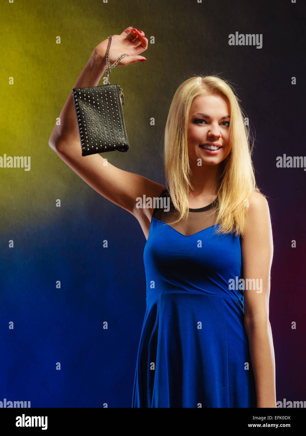 Fashion elegant outfit. Stylish woman fashionable blonde girl holding ...