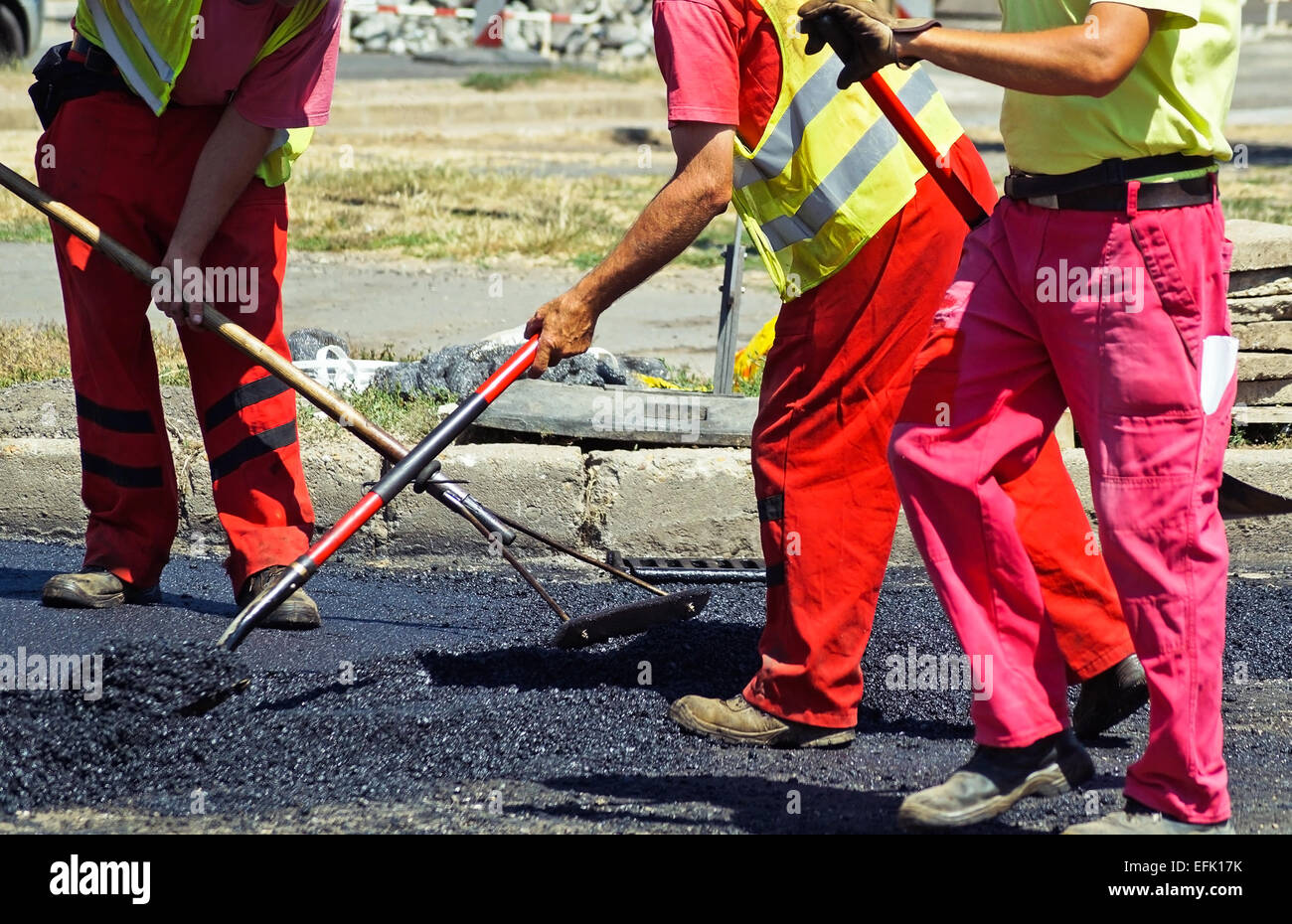 Men are working at the road construction Stock Photo - Alamy